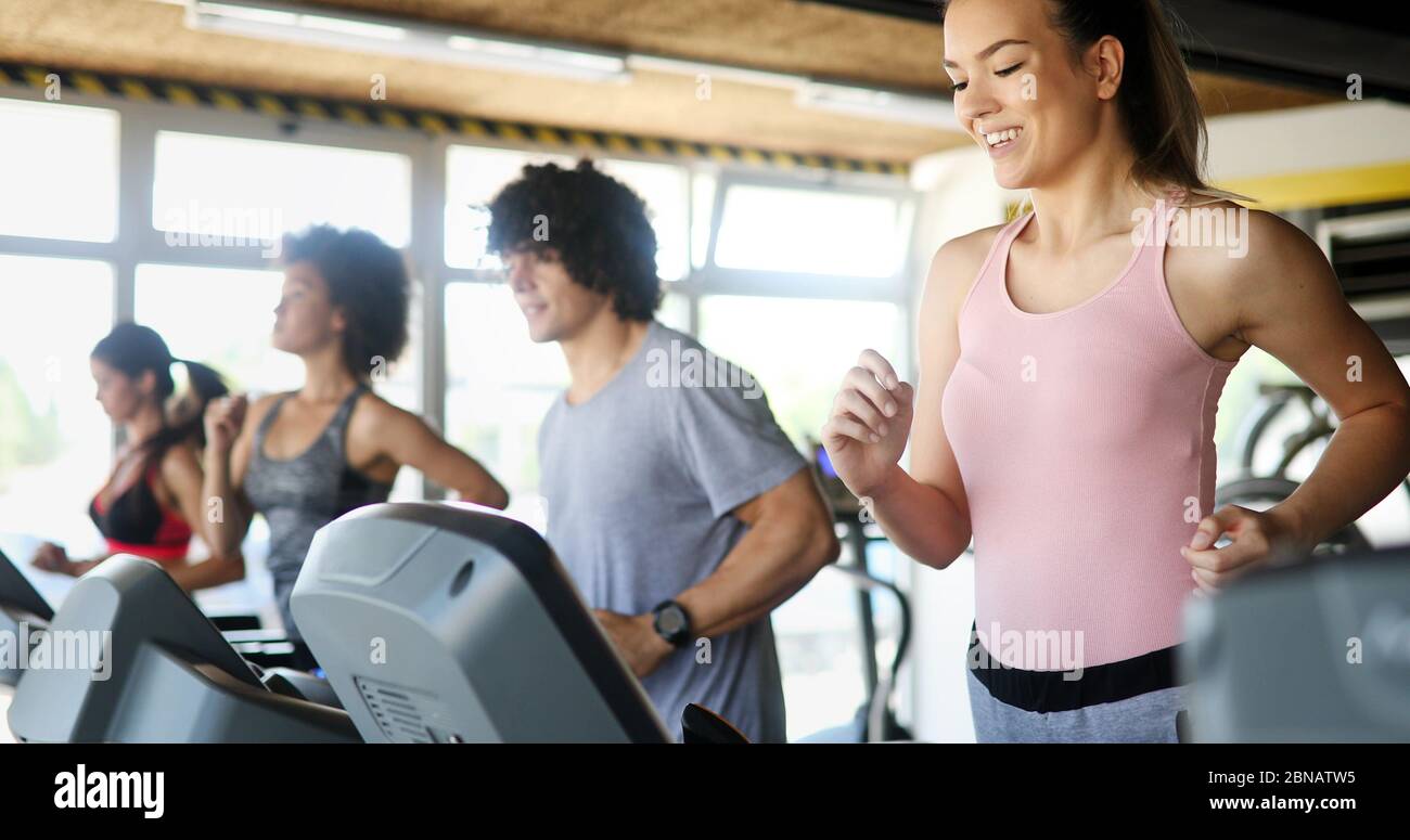Picture of people running on treadmill in gym Stock Photo - Alamy