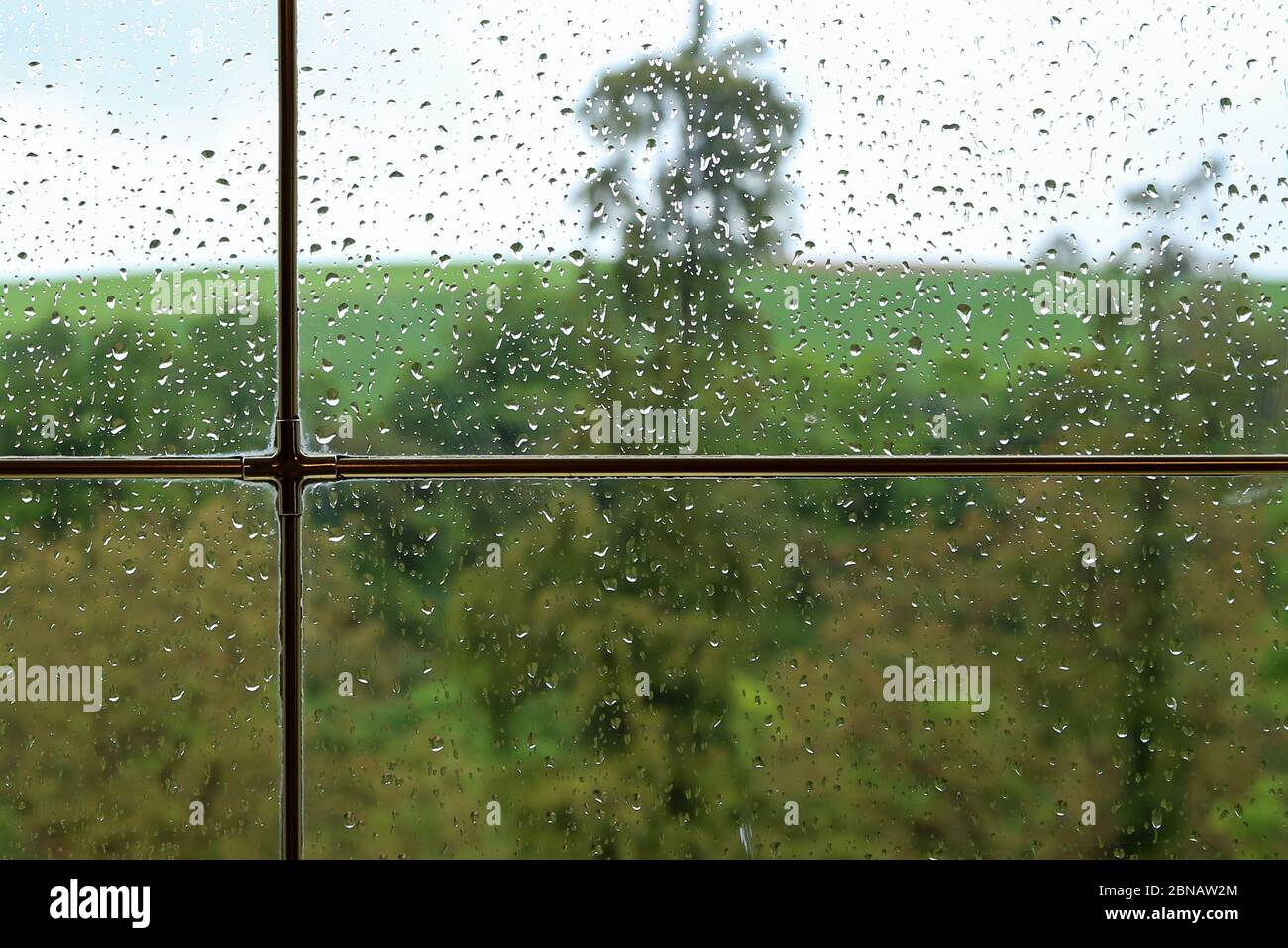 Rainy weather behind wet glass of a house window Stock Photo - Alamy