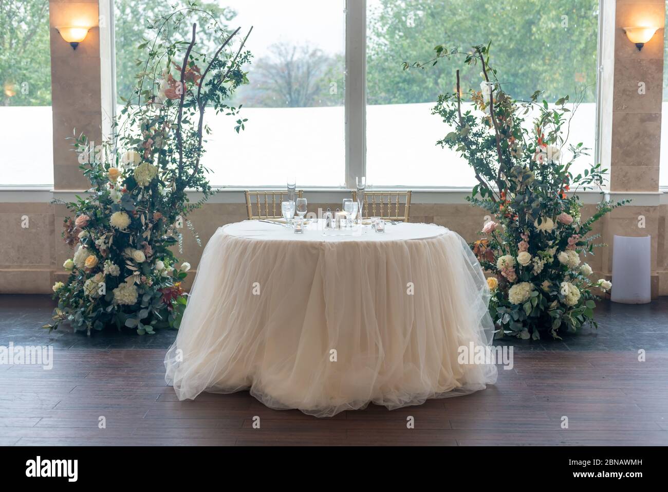 Small white table for two personas and beautiful floral wedding ...