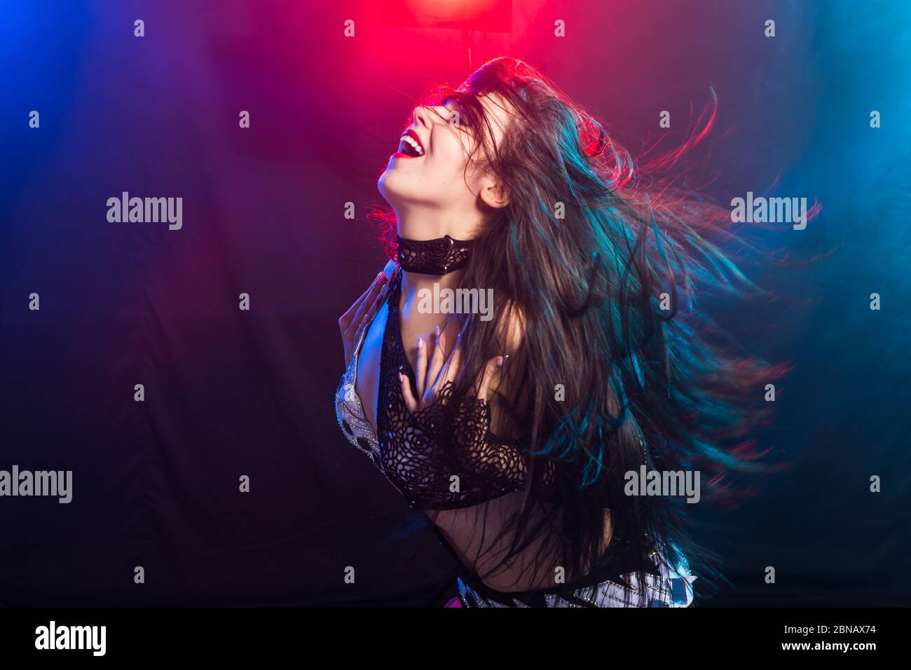 Belly dancer. Young attractive woman dancing tribal fusion on the stage ...