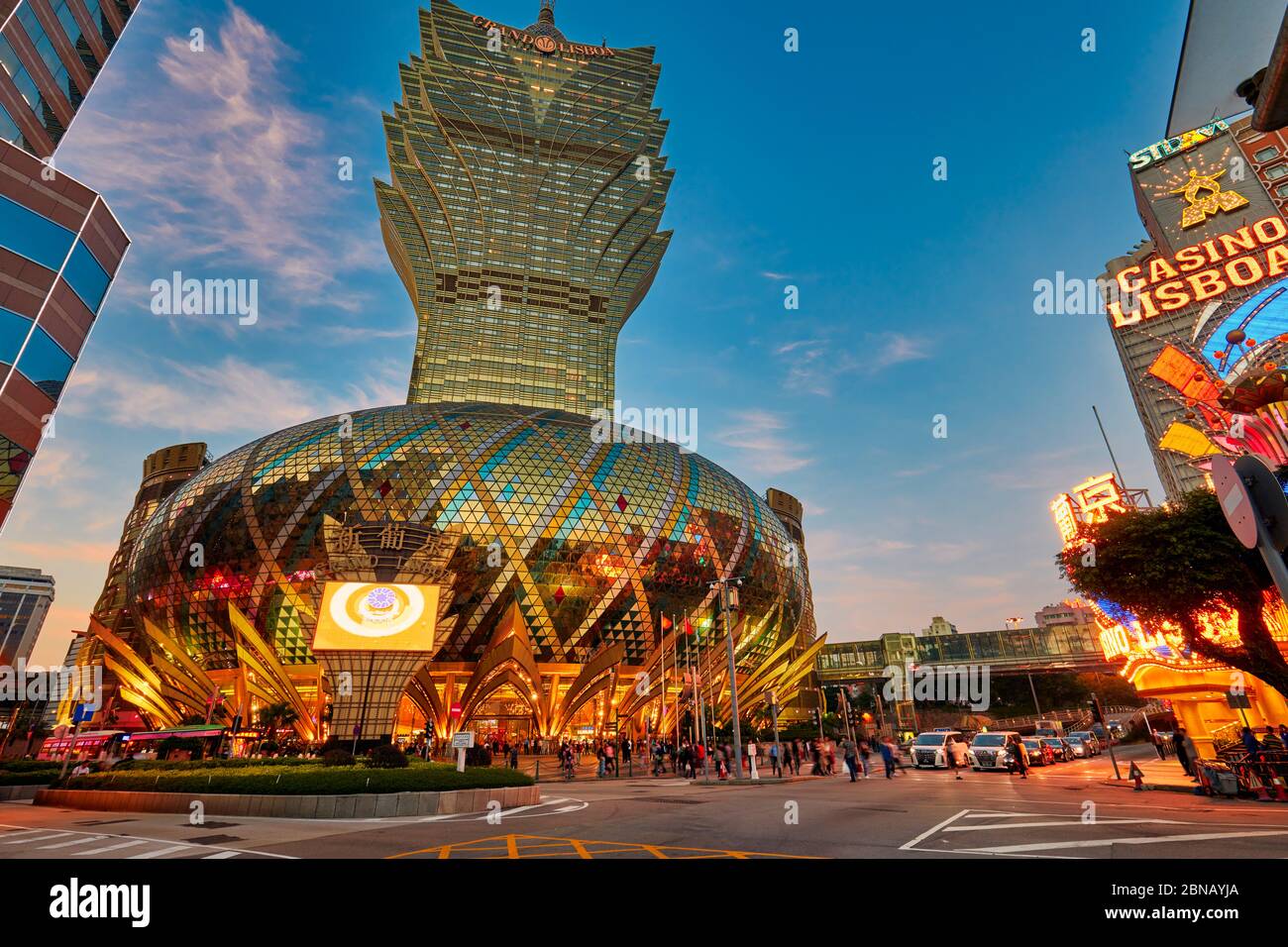 Colourful building of the Hotel Grand Lisboa illuminated at dusk. Macau ...