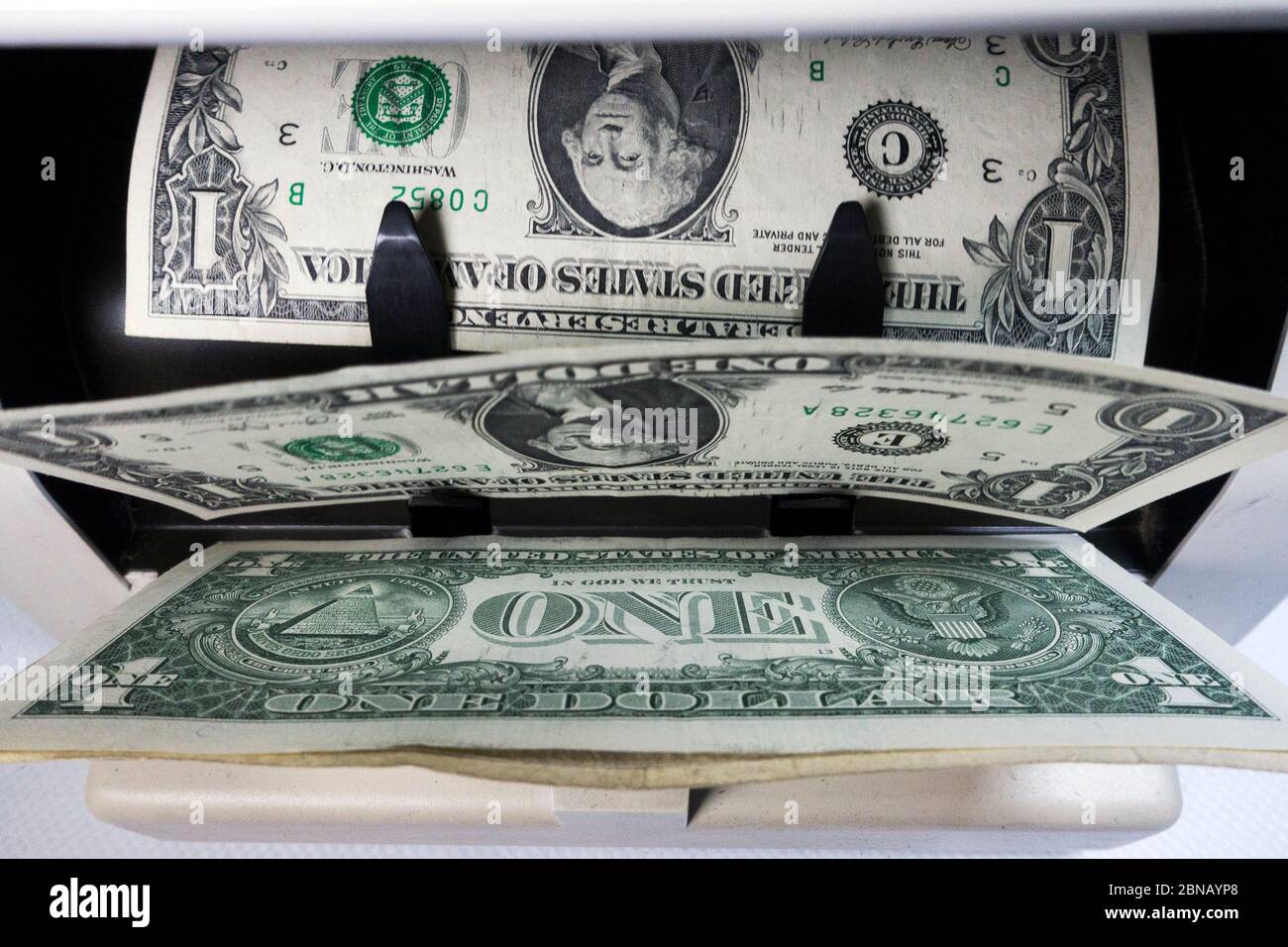 electronic money counter machine is counting the American one dollar(US ...