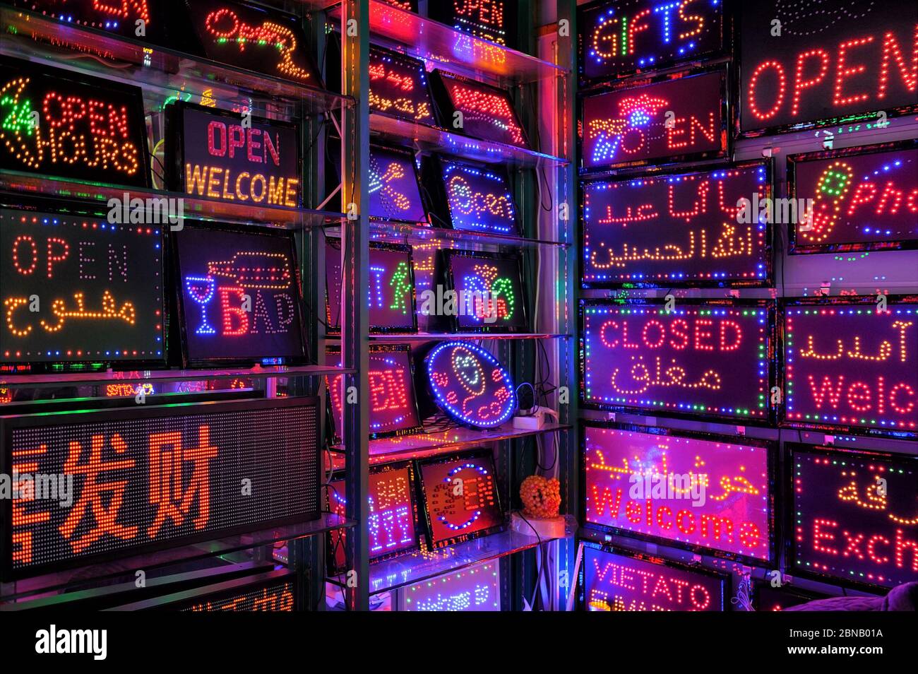 Huge variety of colorful neon shop, text in different languages Stock ...