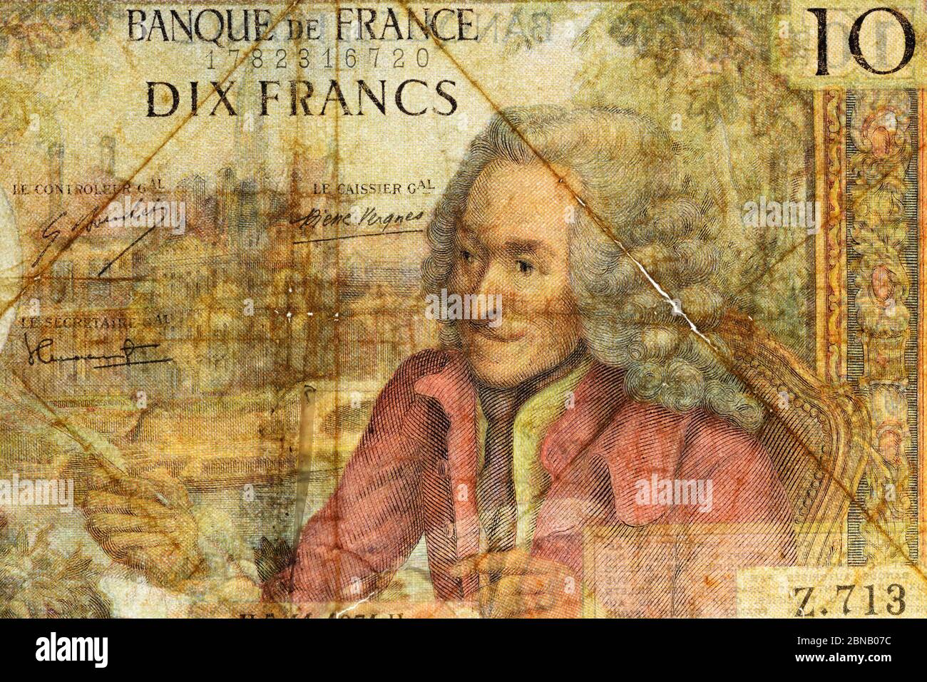 Close-up at an ancient, outdated ten Francs French banknote. Details of ...