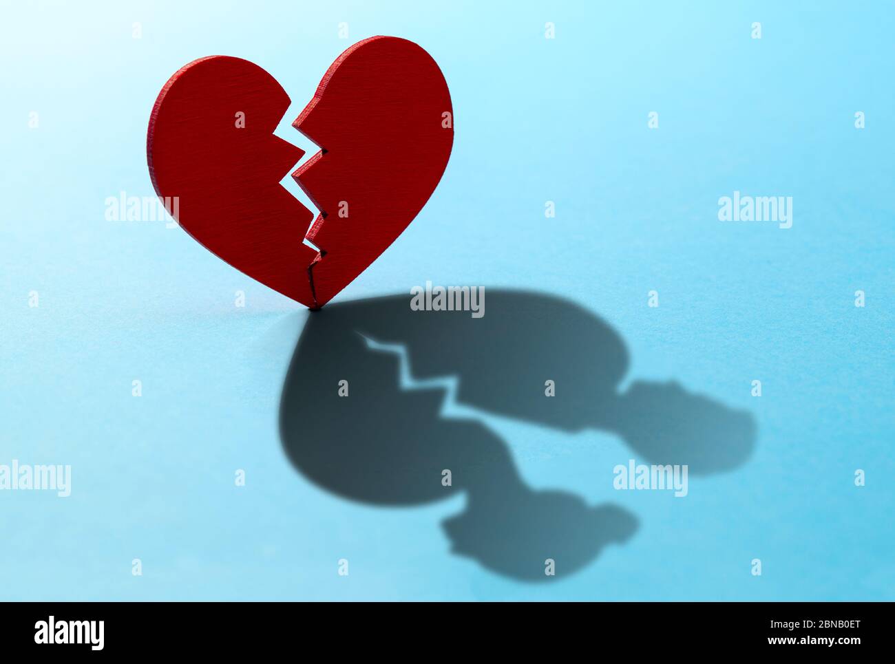 Broken heart. Crack in the red heart, Breaking the relationship. Shadow ...