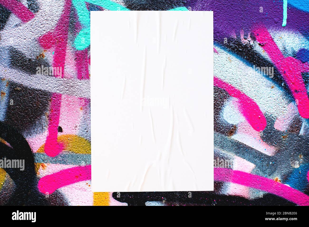 Closeup of colorful messy painted urban wall texture with wrinkled ...