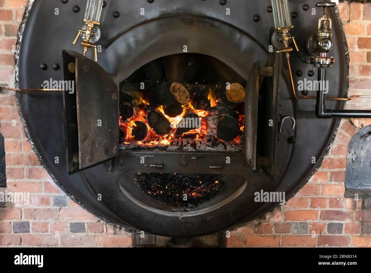 A vintage wood burning furnace for the generation of steam power Stock ...
