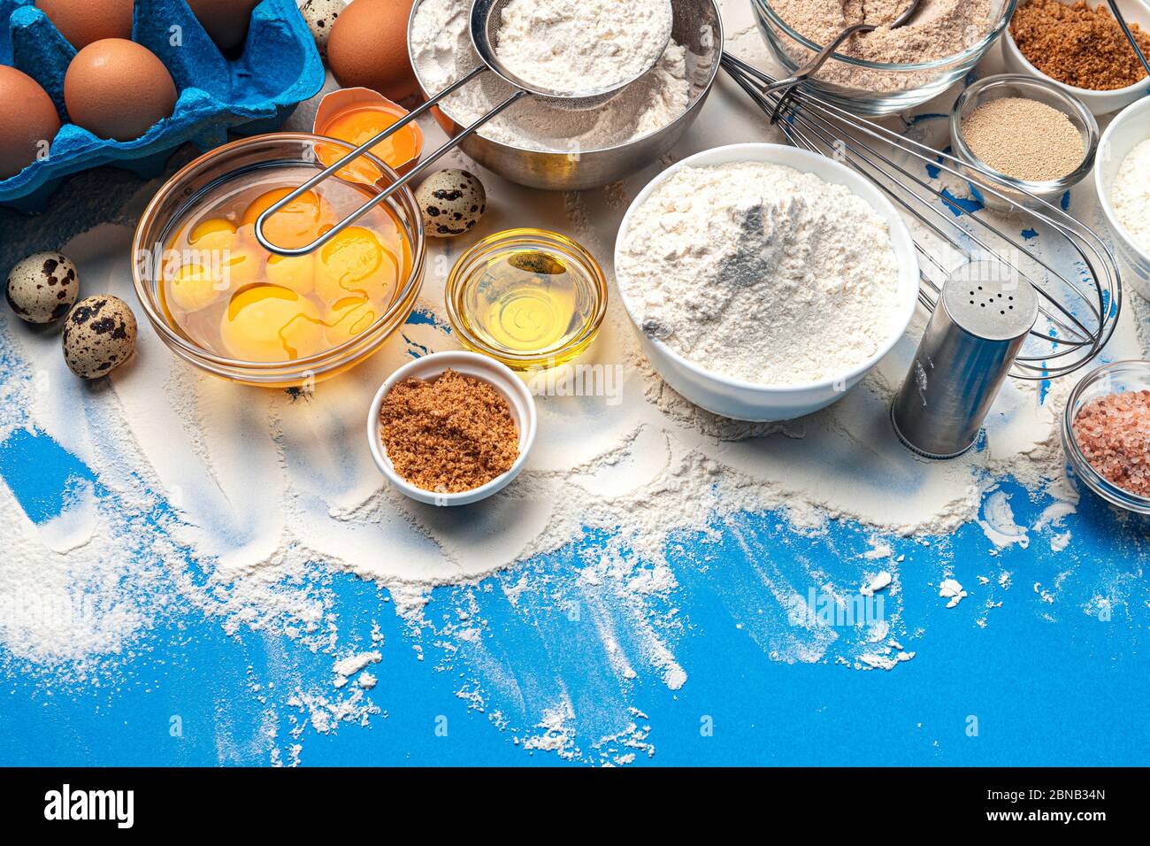 Baking ingredients on blue color background, top view Stock Photo - Alamy