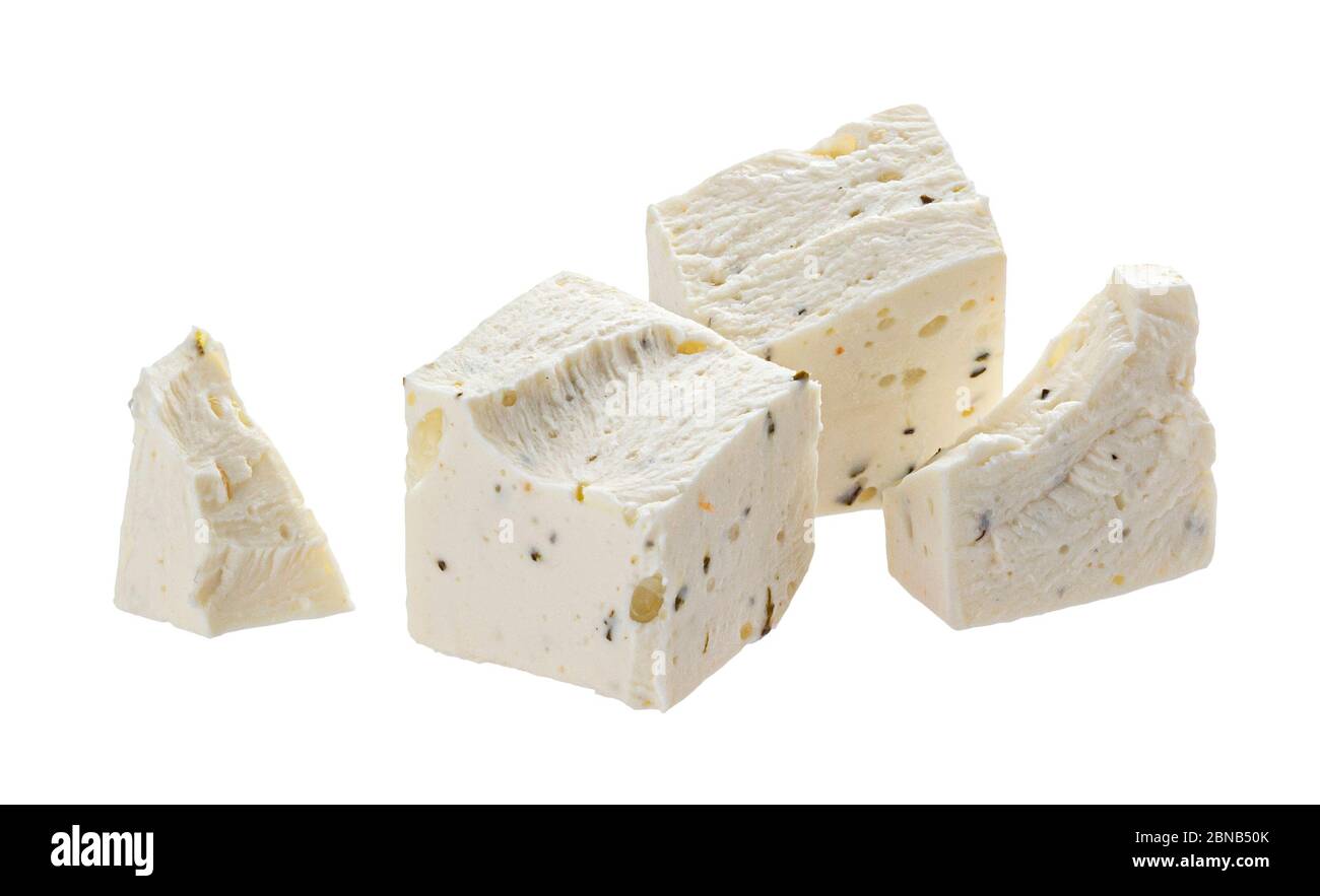 Greek feta pieces with herbs and spices isolated on white background ...