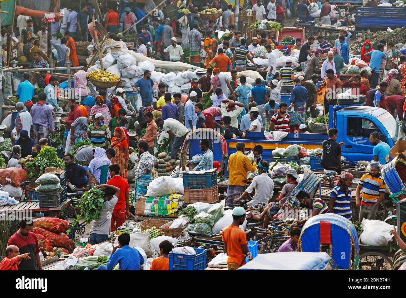 The swarming crowd of people at the kitchen market in the capital’s ...