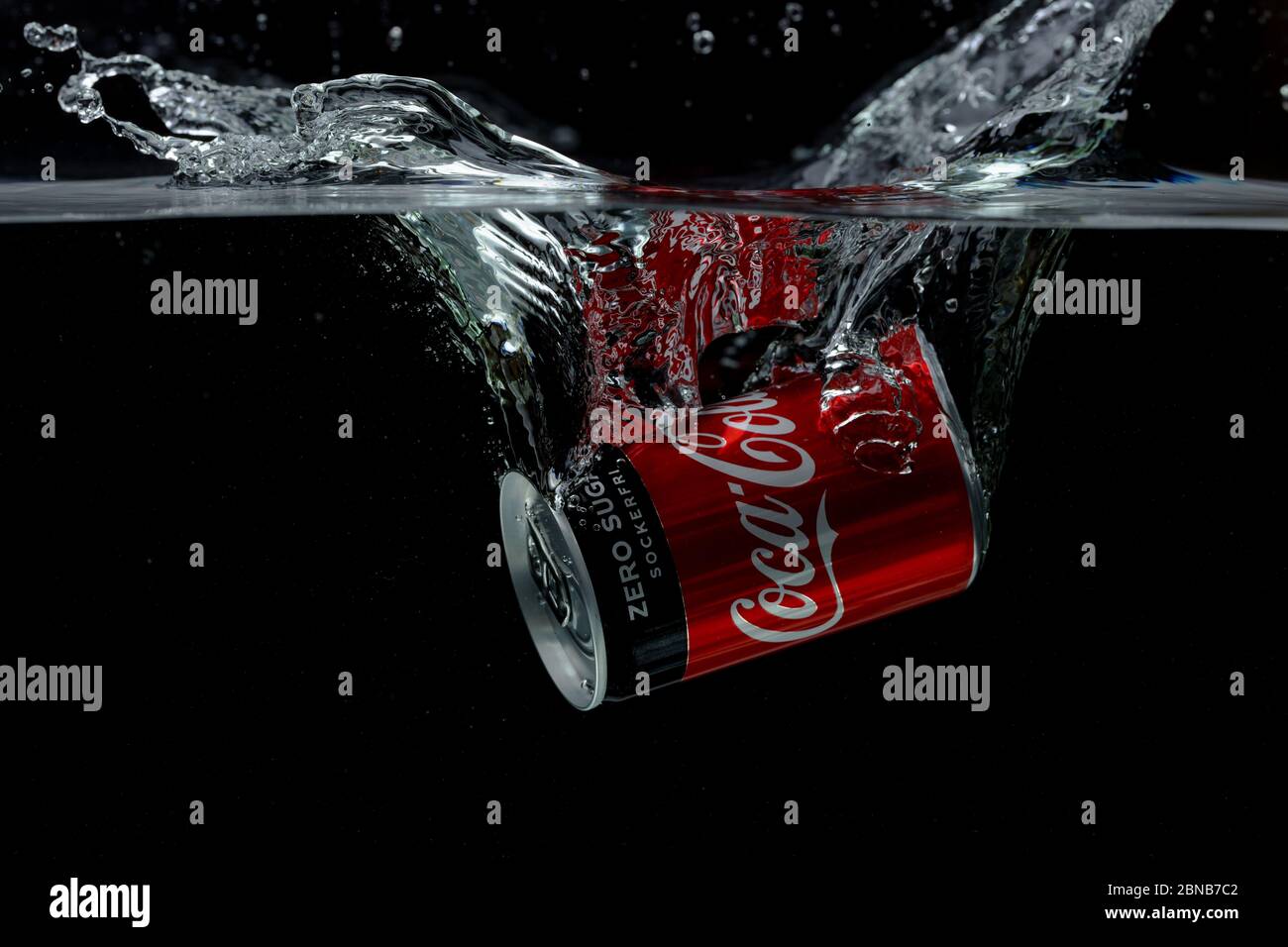 Close up view of cans of Coca Cola falling into water with spray Stock ...