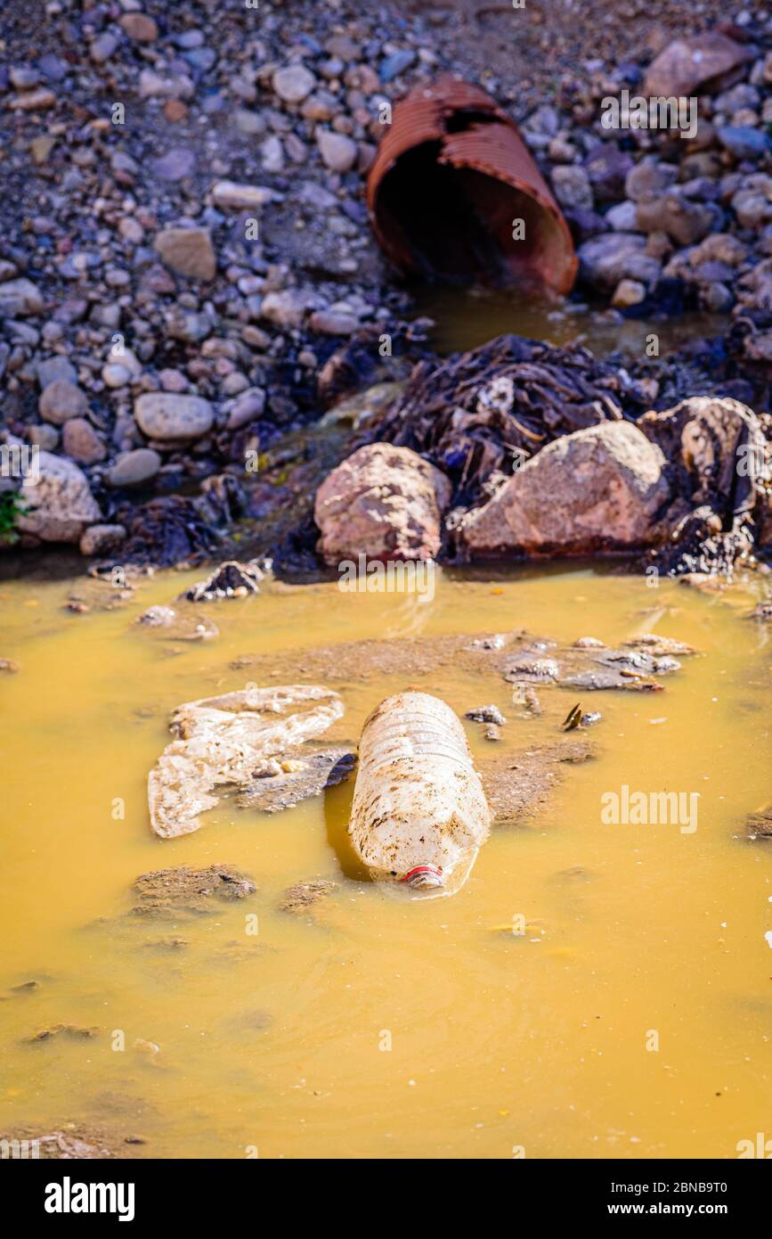 illegal dumping of polluting waters into the environment Stock Photo ...