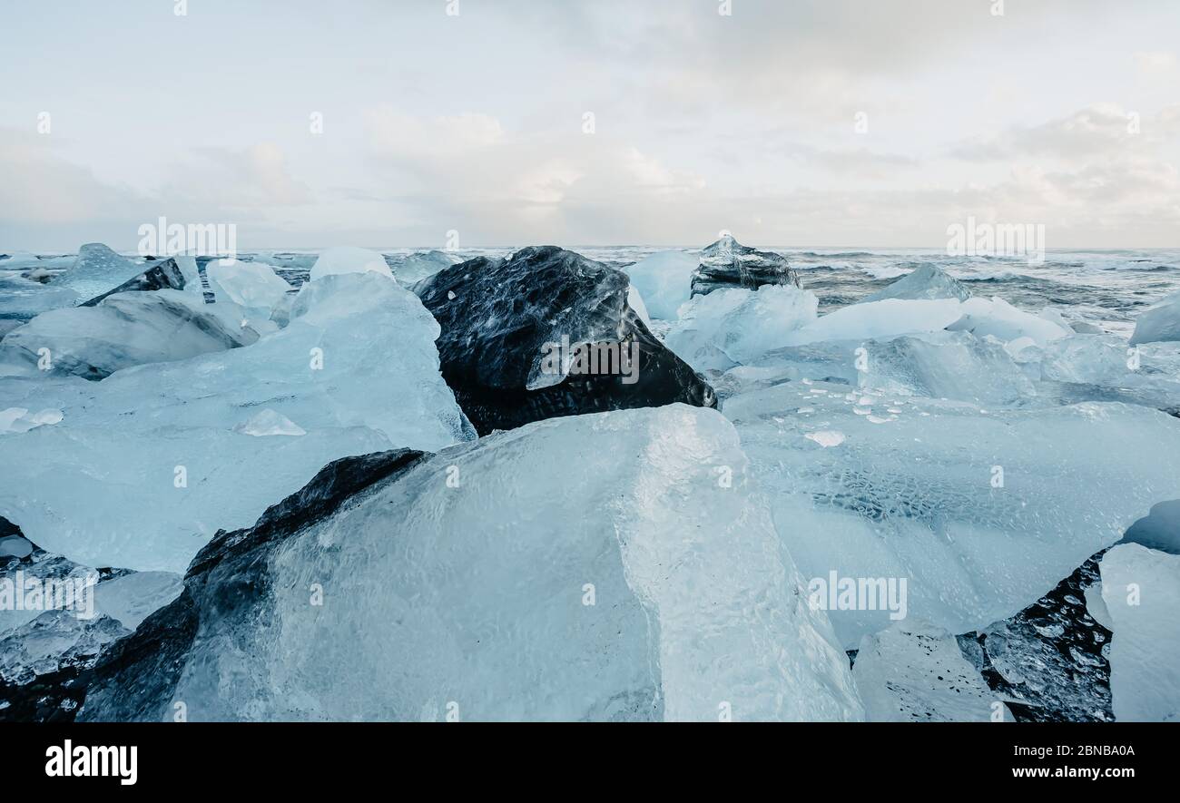 Breathtaking diamond beach on Iceland in winter with large ice blocks ...
