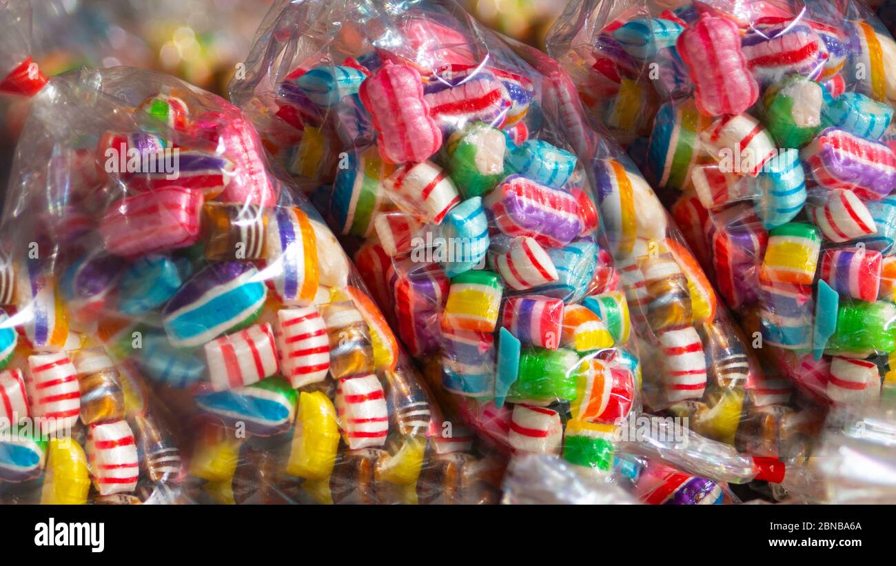 Colorful candies in plastic packaging Stock Photo - Alamy