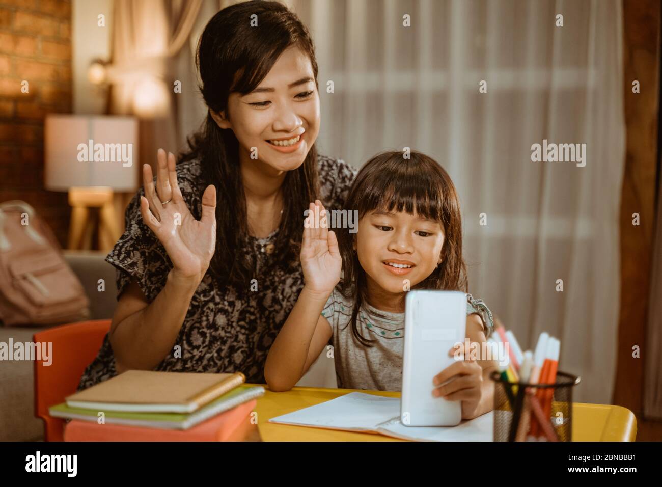 communication using video call. mother and daughter calling with ...
