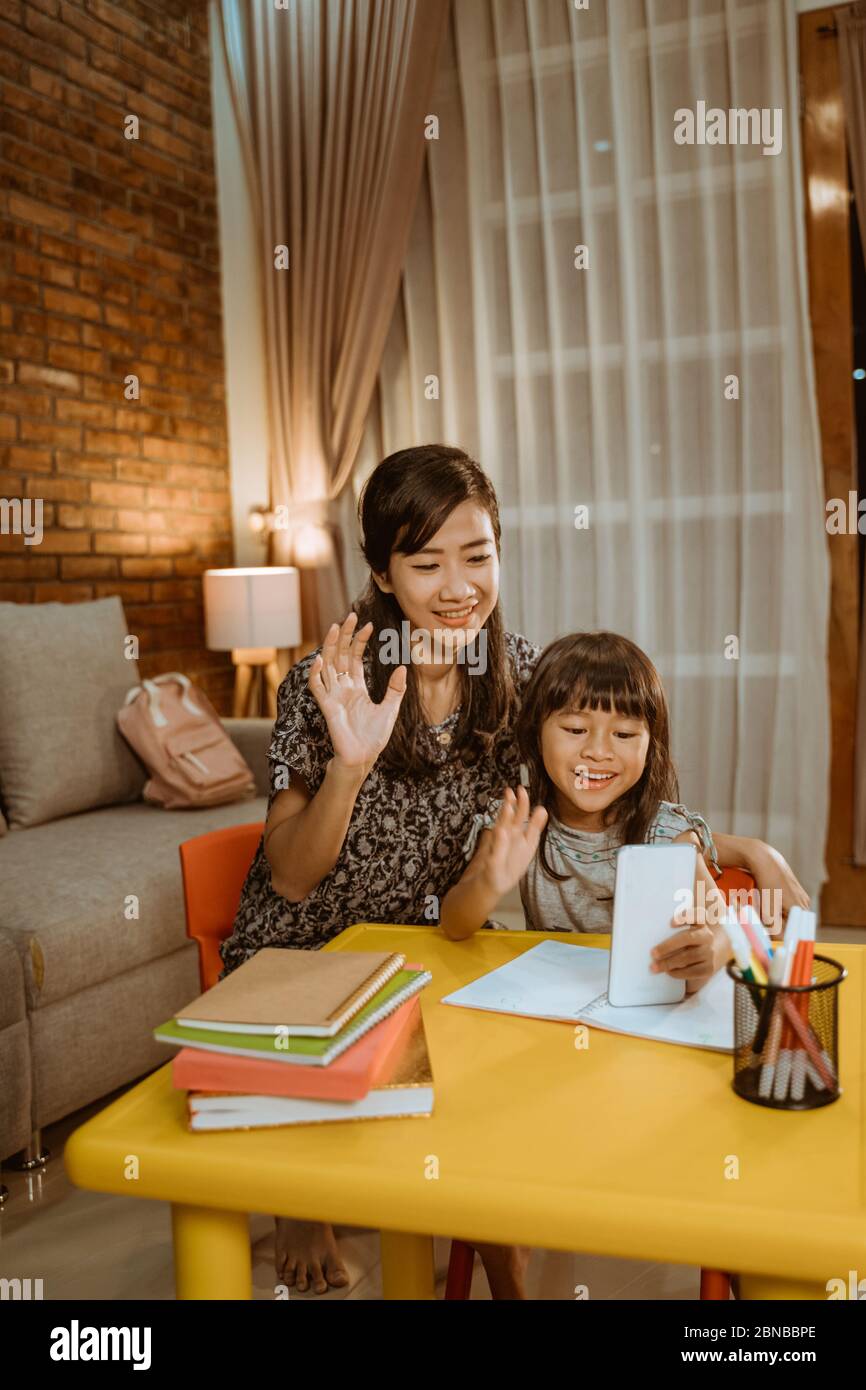 communication using video call. mother and daughter calling with ...