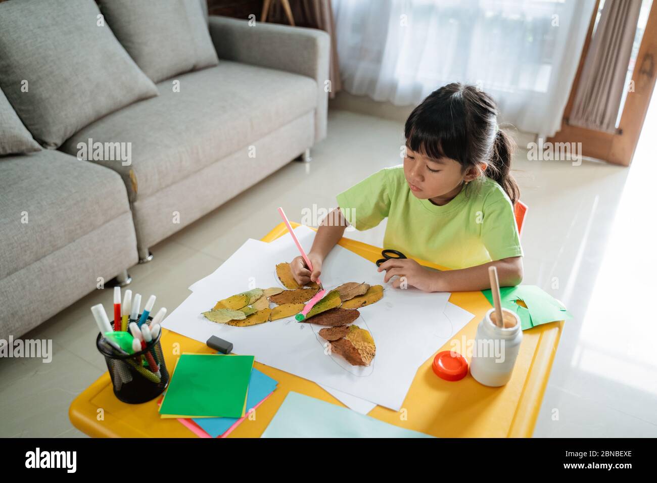 child activity making craft creativity from a dry leaves Stock Photo ...