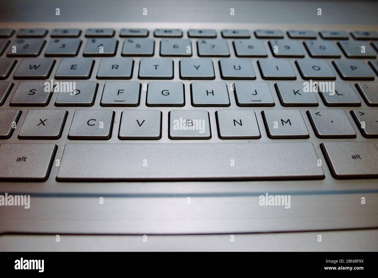 Closeup shot of a silver laptop keyboard Stock Photo - Alamy