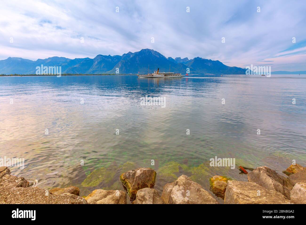 Panoramic view of Lake Geneva, Switzerland with ship and mountains ...