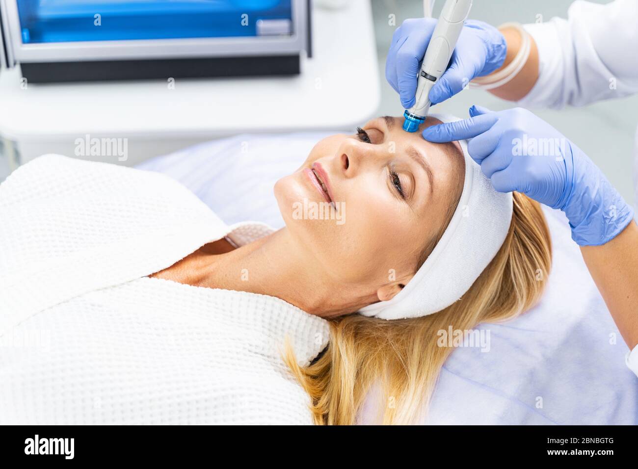 Female patient undergoing a skin cleansing procedure Stock Photo - Alamy