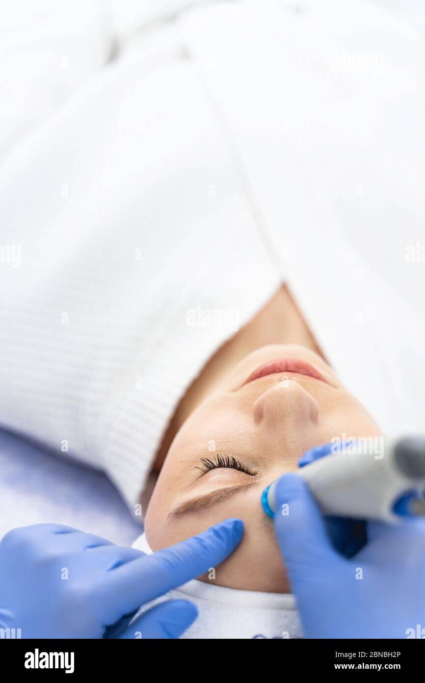 Woman being treated by a professional dermatologist Stock Photo - Alamy