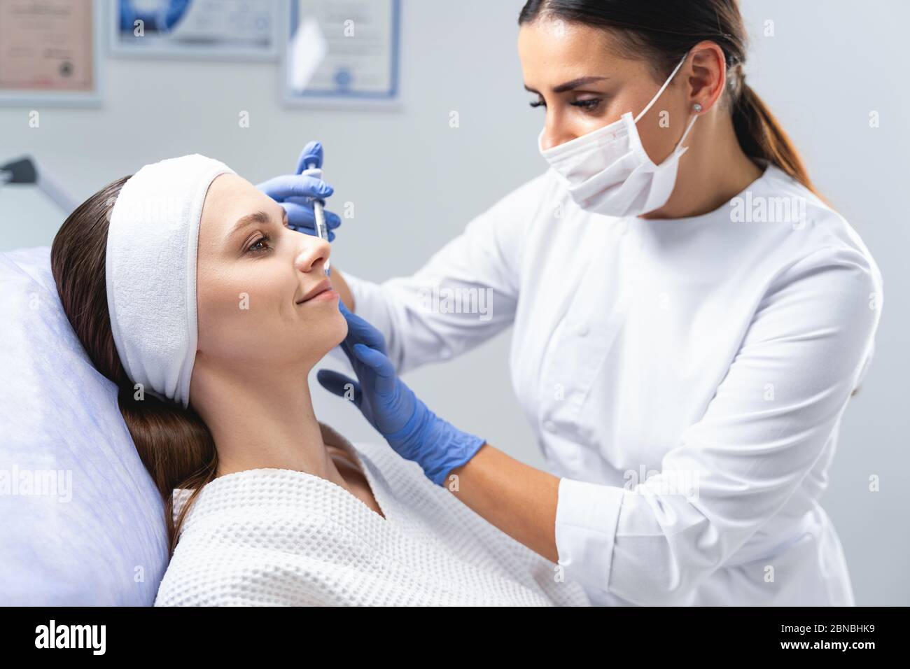 Woman injection face smiling hi-res stock photography and images - Alamy
