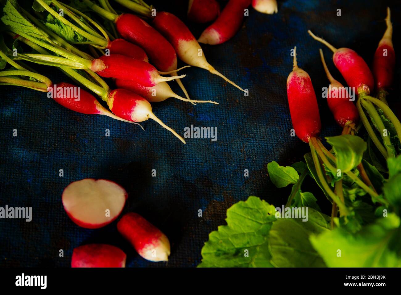 radish on a blue background laid out in groups Stock Photo - Alamy