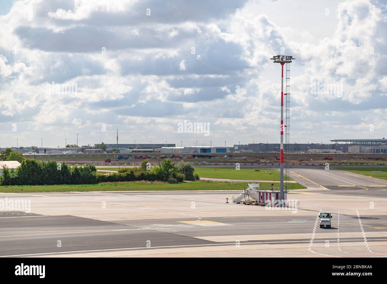 Empty airfield with control tower and company car Stock Photo - Alamy