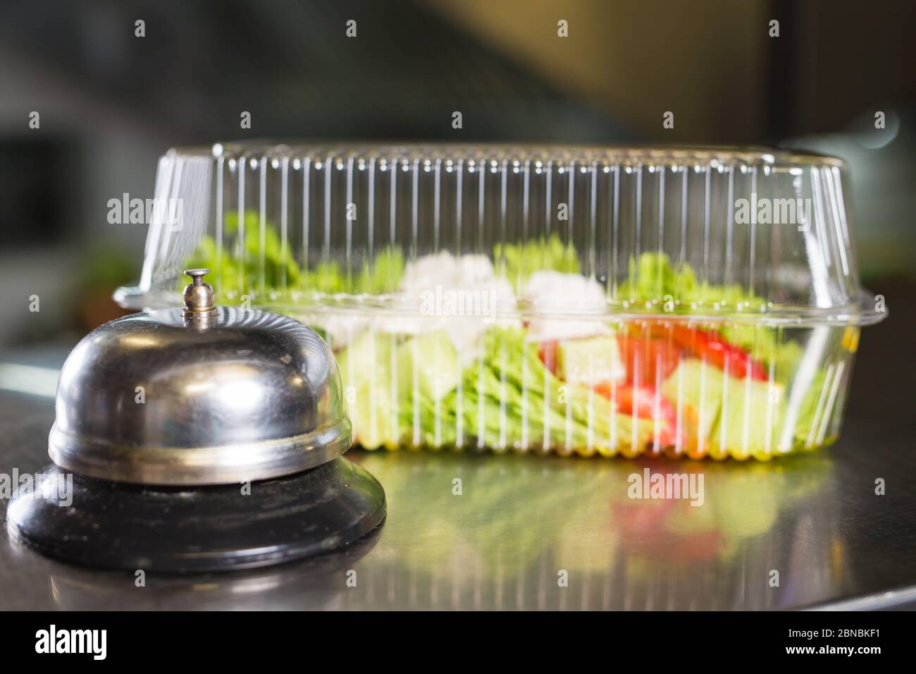 cooking in a restaurant and packing in a container for delivery Stock ...