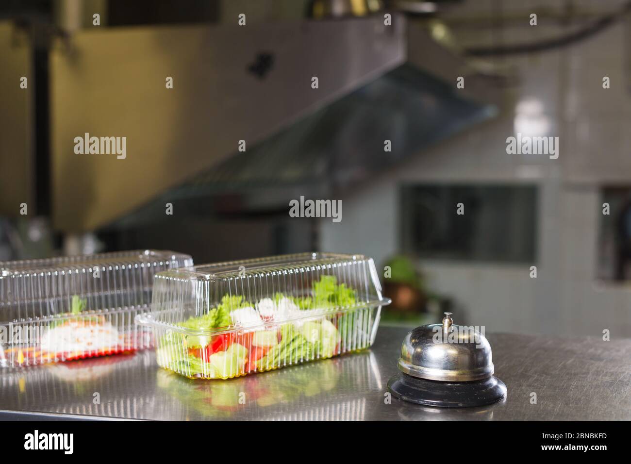 cooking in a restaurant and packing in a container for delivery Stock ...