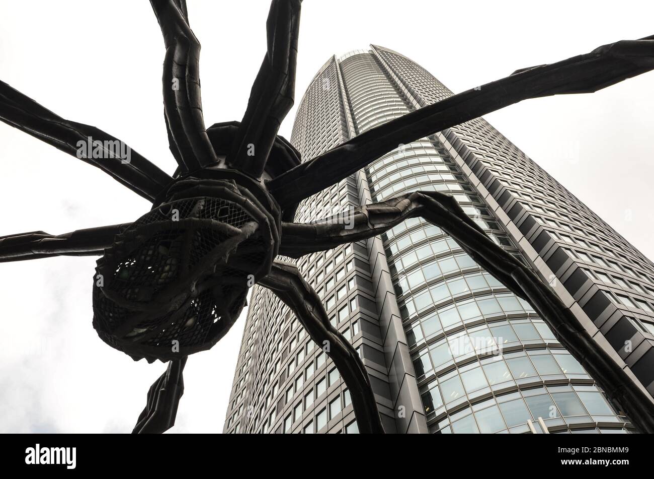 Low angle closeup shot of the spider statue by the Mori Tower, Tokyo ...