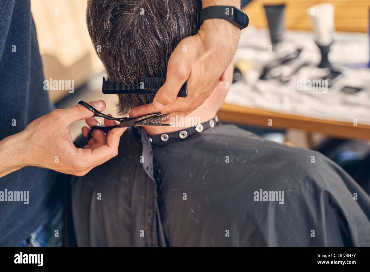 Process of making fashionable haircut in the barber shop Stock Photo ...