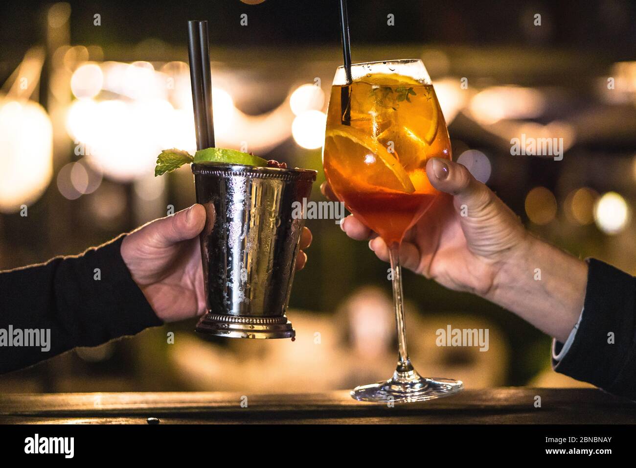 People drinking cocktail together with blurred background Stock Photo ...
