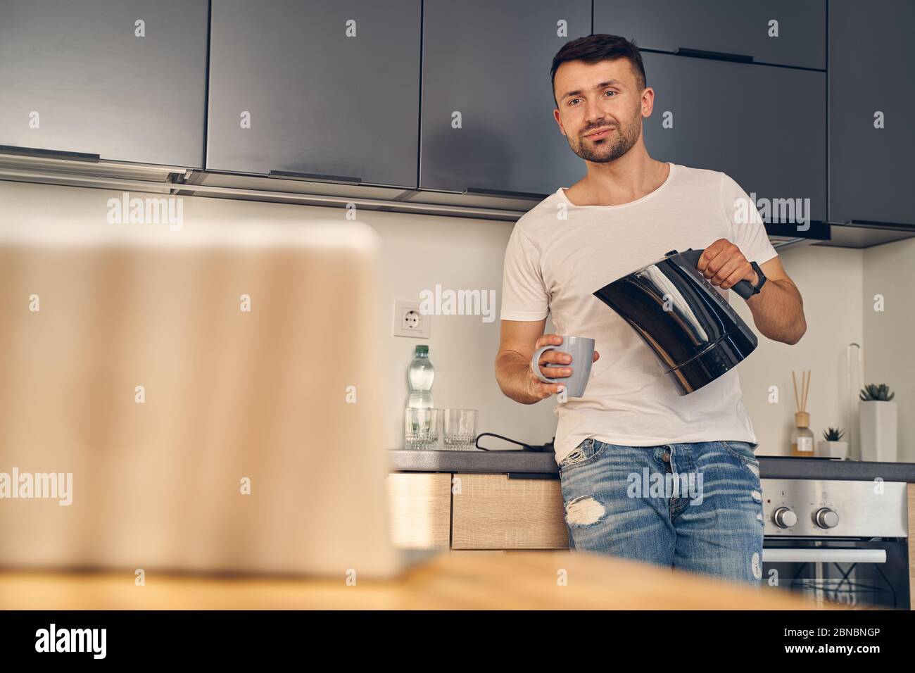 Man holding glass water cup hi-res stock photography and images - Alamy