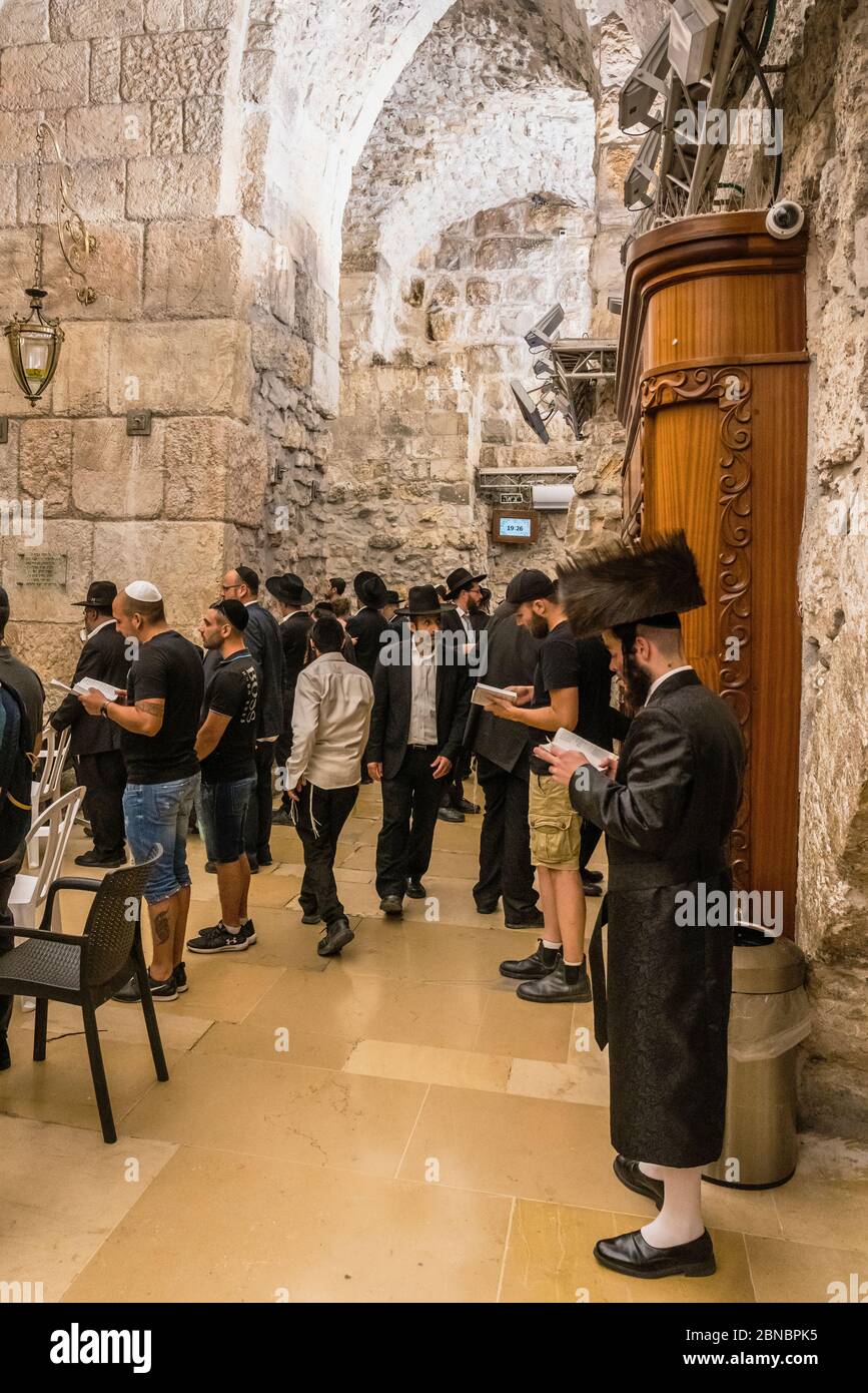 Israel, Jerusalem, Western Wall, Jewish men worship in the synagogue ...