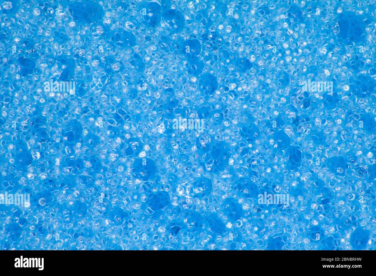 Kitchen sponge in dark blue color used mainly for washing dishes, in ...