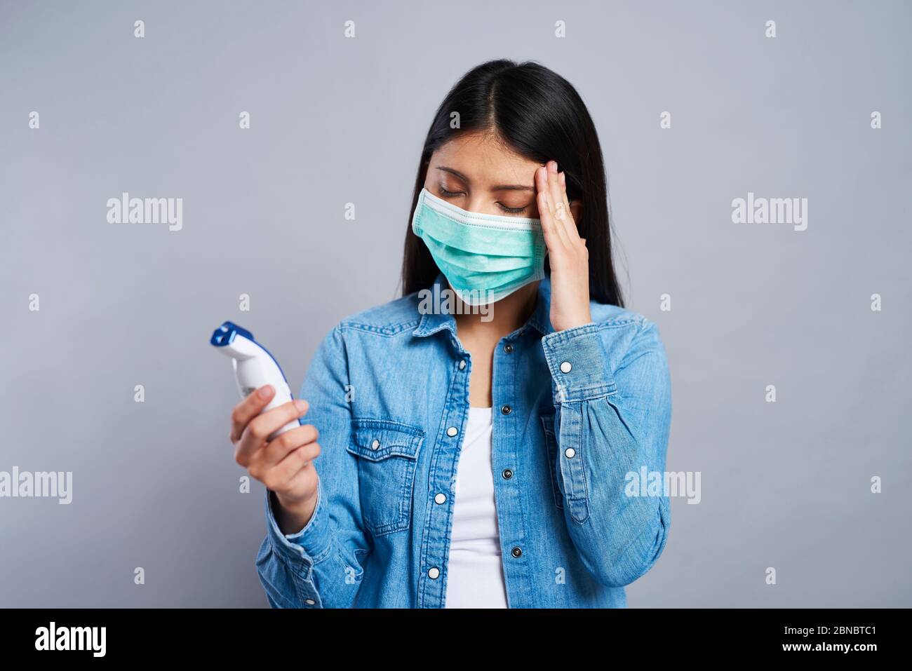 Asian woman feeling to have a temperature Stock Photo - Alamy