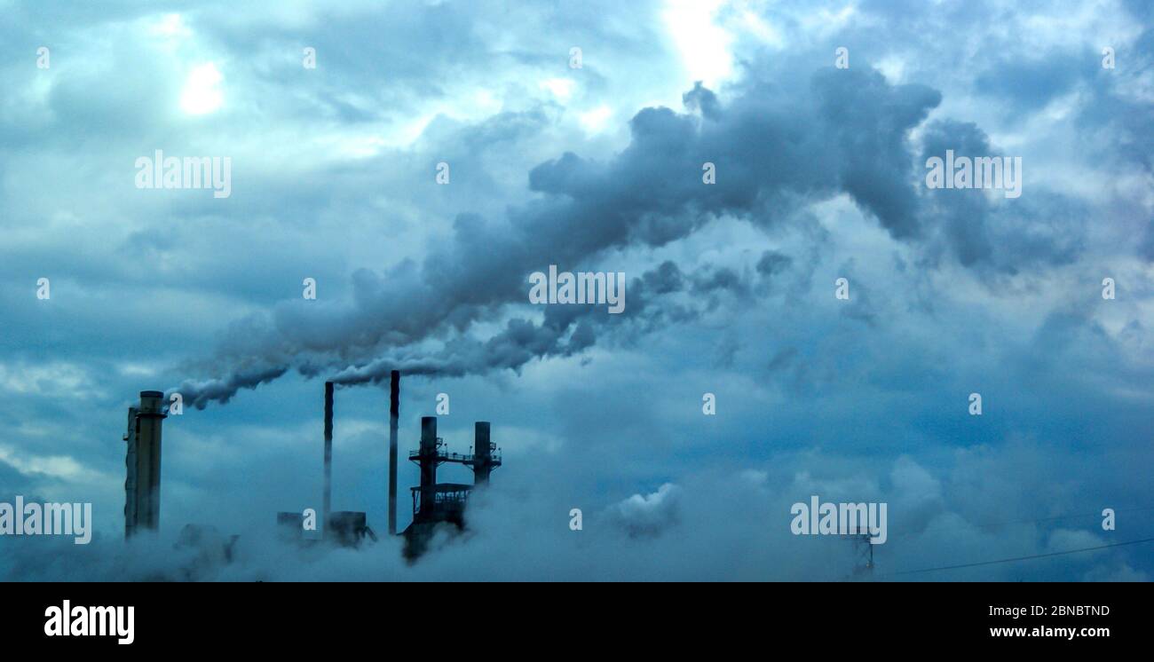 Aerial shot of a factory chimneys polluting the beautiful sky Stock ...