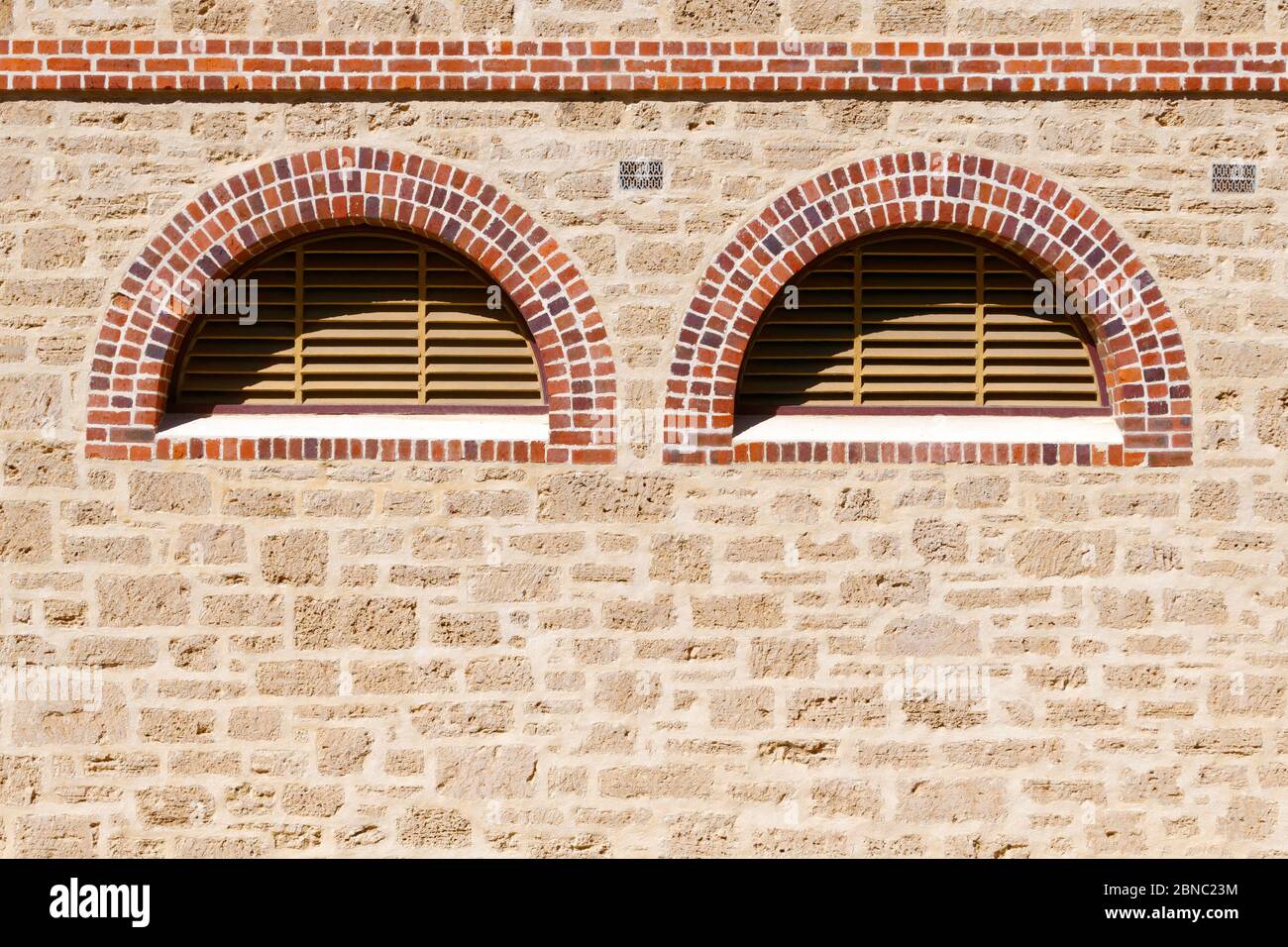 Sandstone brick wall with arched windows, Fremantle, Western Australia ...