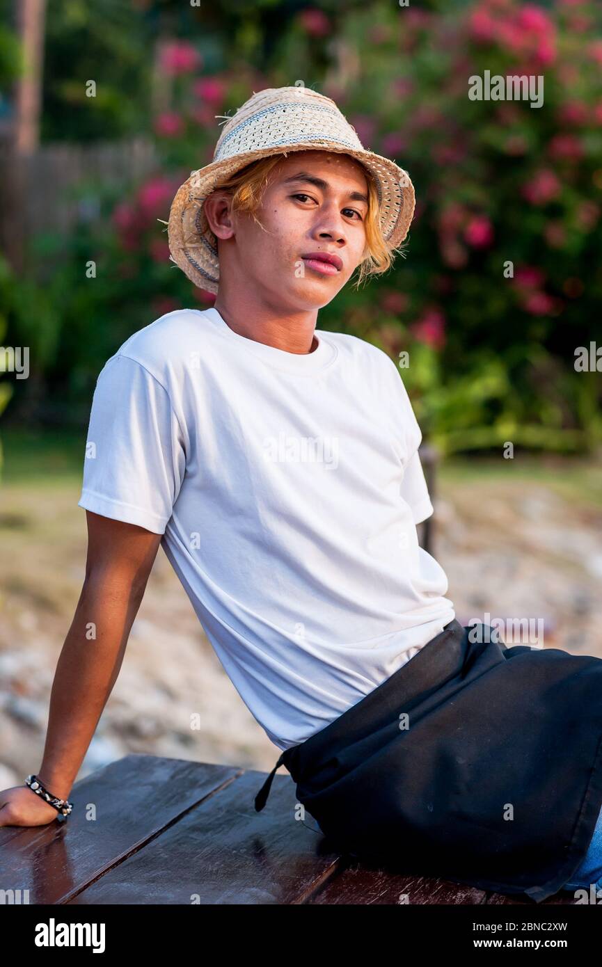 A handsome filipino guy poses on Las Cabanas Beach, El Nido ...