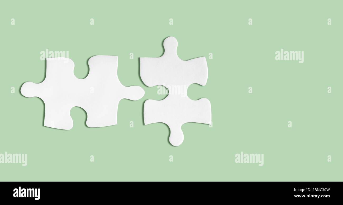 Paper puzzle pieces mockup isolated on green background. Ideal matching ...