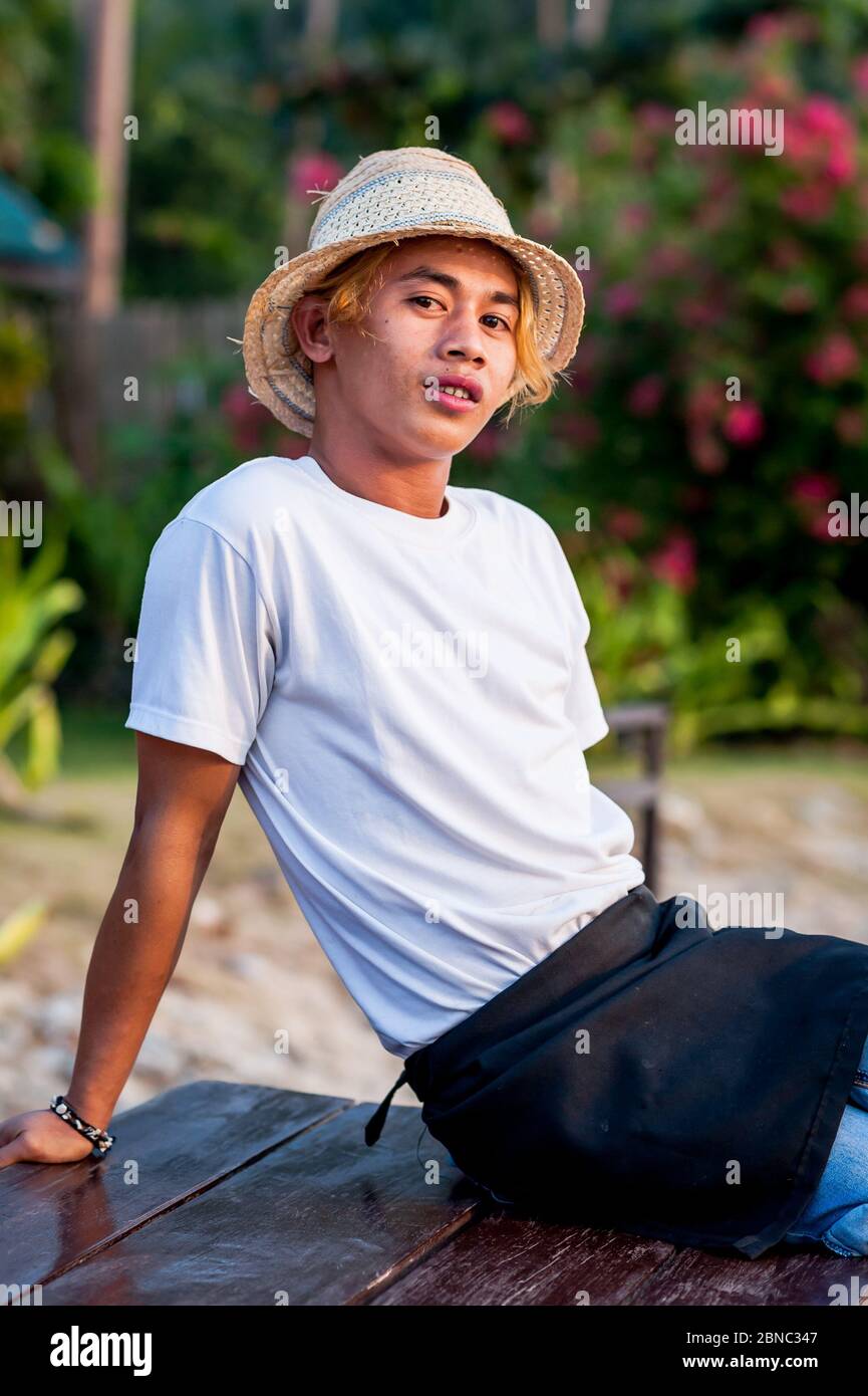 A handsome filipino guy poses on Las Cabanas Beach, El Nido ...