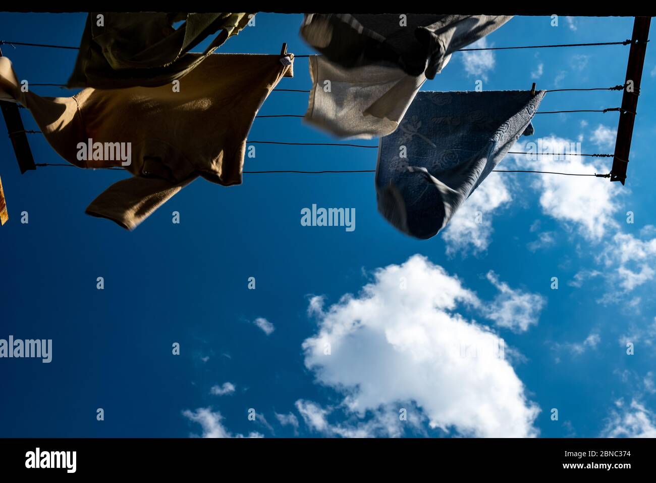 Children's clothes on laundry line hi-res stock photography and images ...