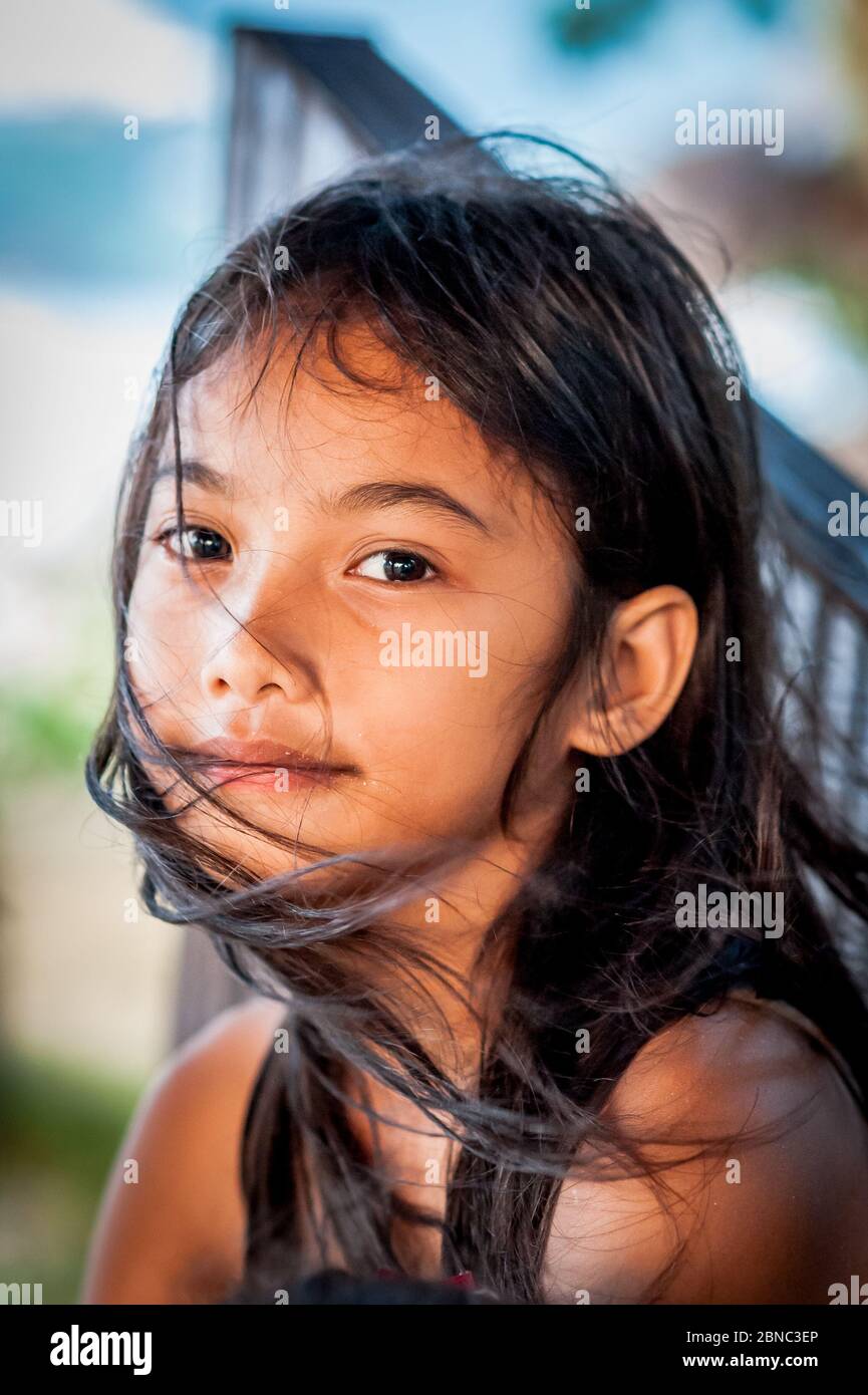 A pretty Filipino girl smiles on Las Cabanas Beach, El Nido ...