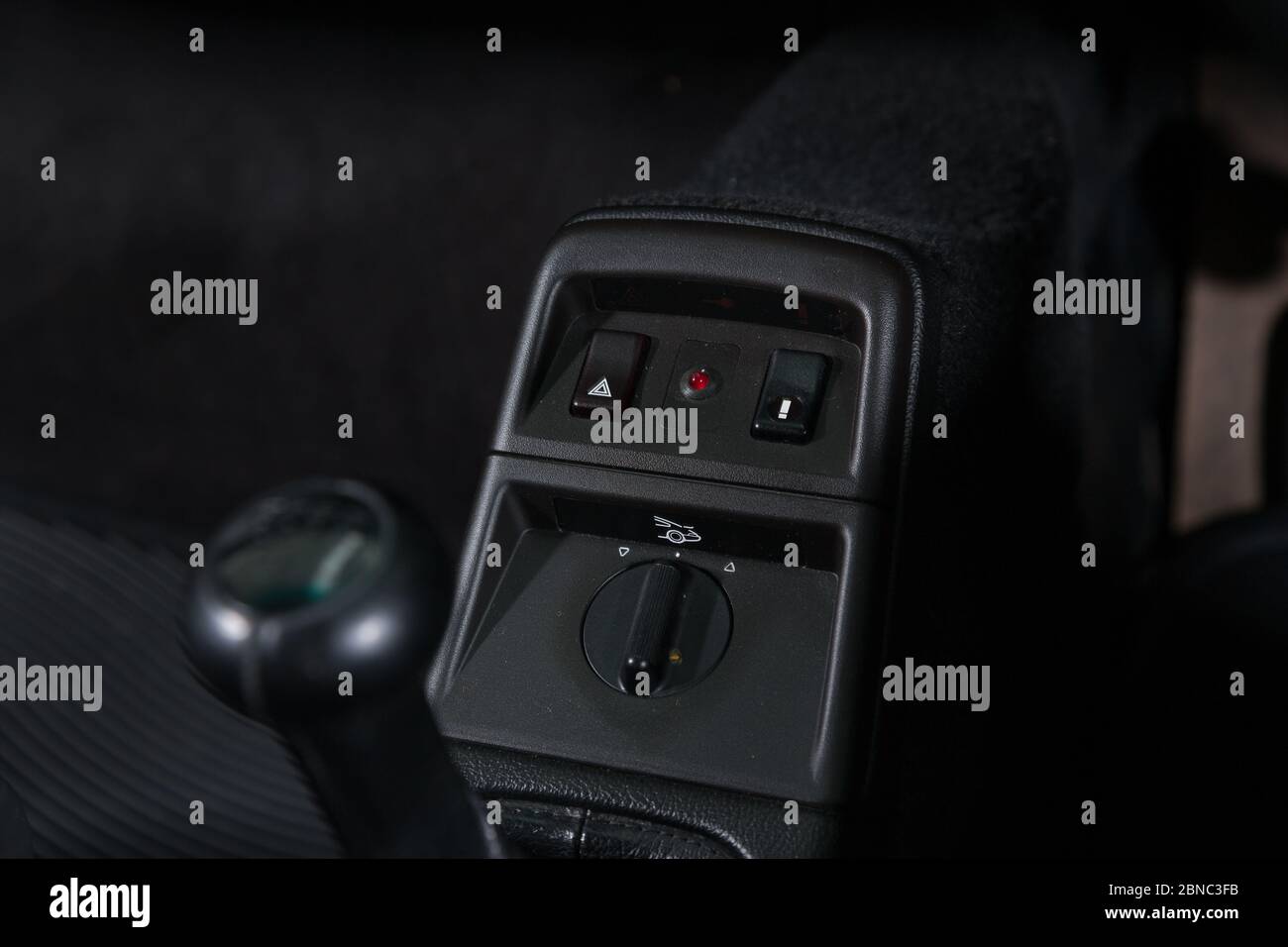Gear shift and control buttons of a black car Stock Photo - Alamy