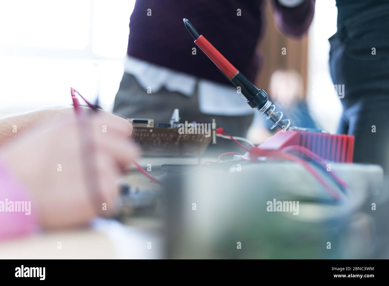 Scientists engineers designing small human robot, setting artificial ... Scientists engineers designing small human robot, setting artificial ...