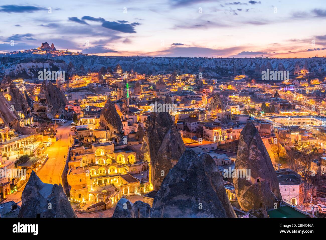 Night view of Goreme town with cave hotel built in rock formation in ...