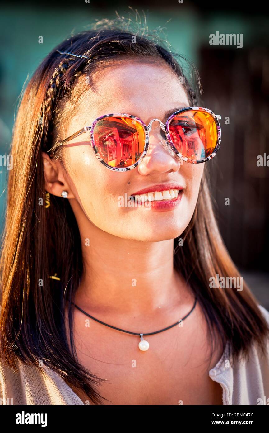 A pretty Filipino girl with a stunning smile poses Stock Photo - Alamy