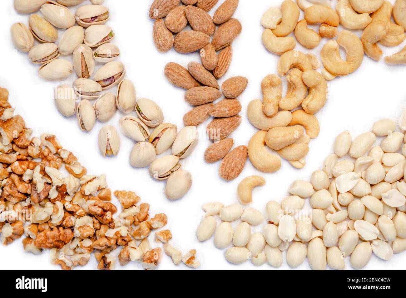 Assortment of nuts on white background. Group of mixed nuts. Top view ...
