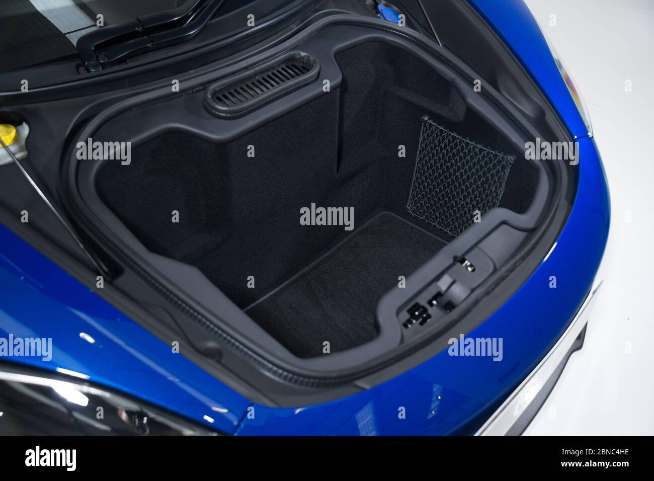 Trunk of the sportscar with white background Stock Photo - Alamy